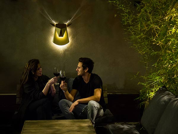 Head Light: Popup Wall Lamp Has Horns that Glow in Shadows - WebUrbanist