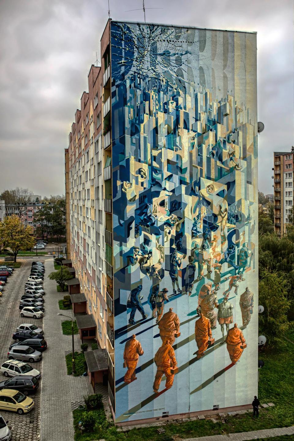 Towers Transformed: Massive Geometric Mural Collaboration - WebUrbanist