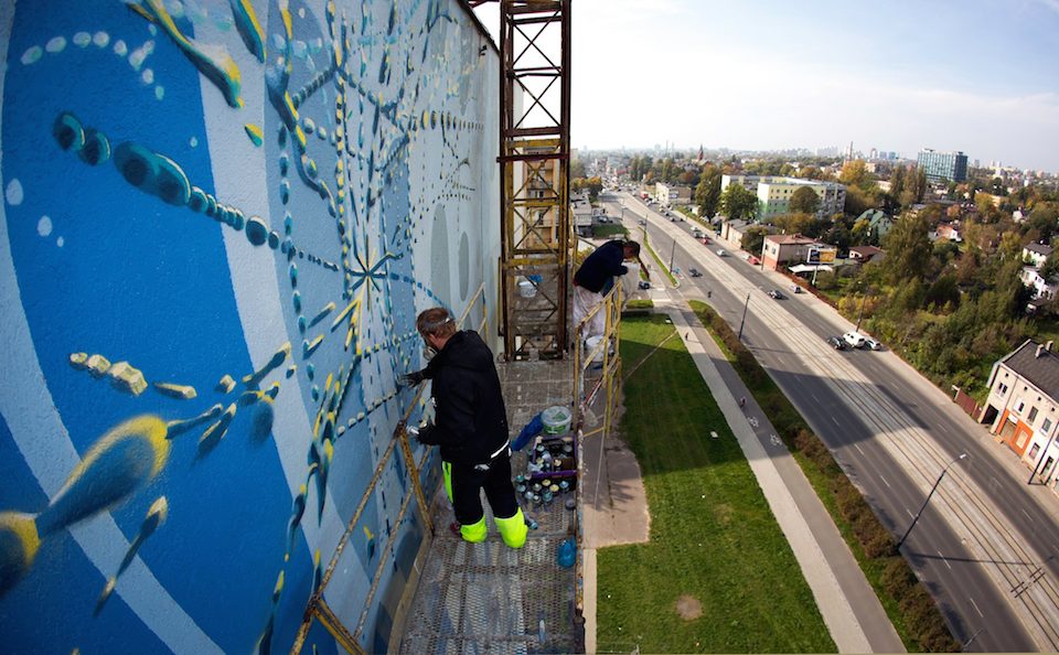 Towers Transformed: Massive Geometric Mural Collaboration - WebUrbanist