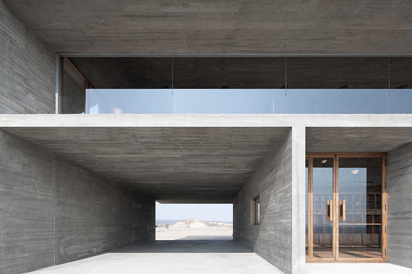 Beach Read: Monumental Concrete Library on the Edge of a Bay - WebUrbanist