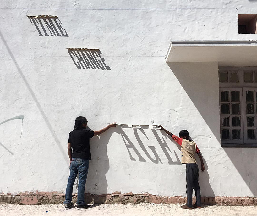 Shadow Graffiti: Typographic Sundial Transforms Building Facade ...